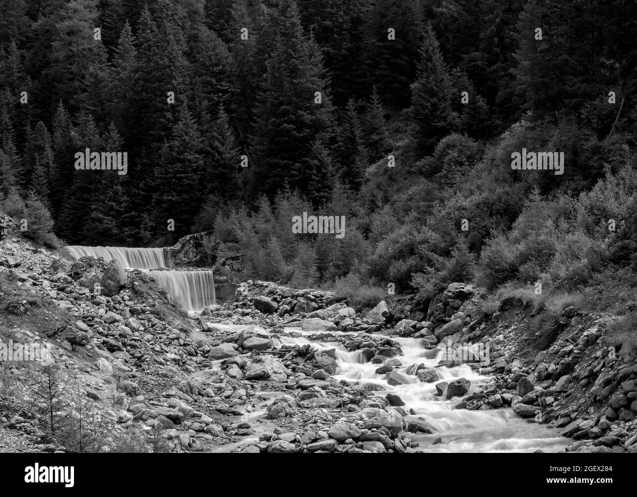 Stream flowing into lake Black and White Stock Photos & Images - Alamy