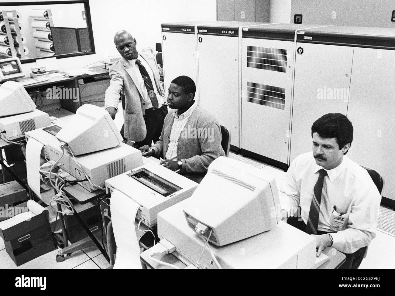 Austin Texas USA, 1990: Employees type data into computer terminals ...