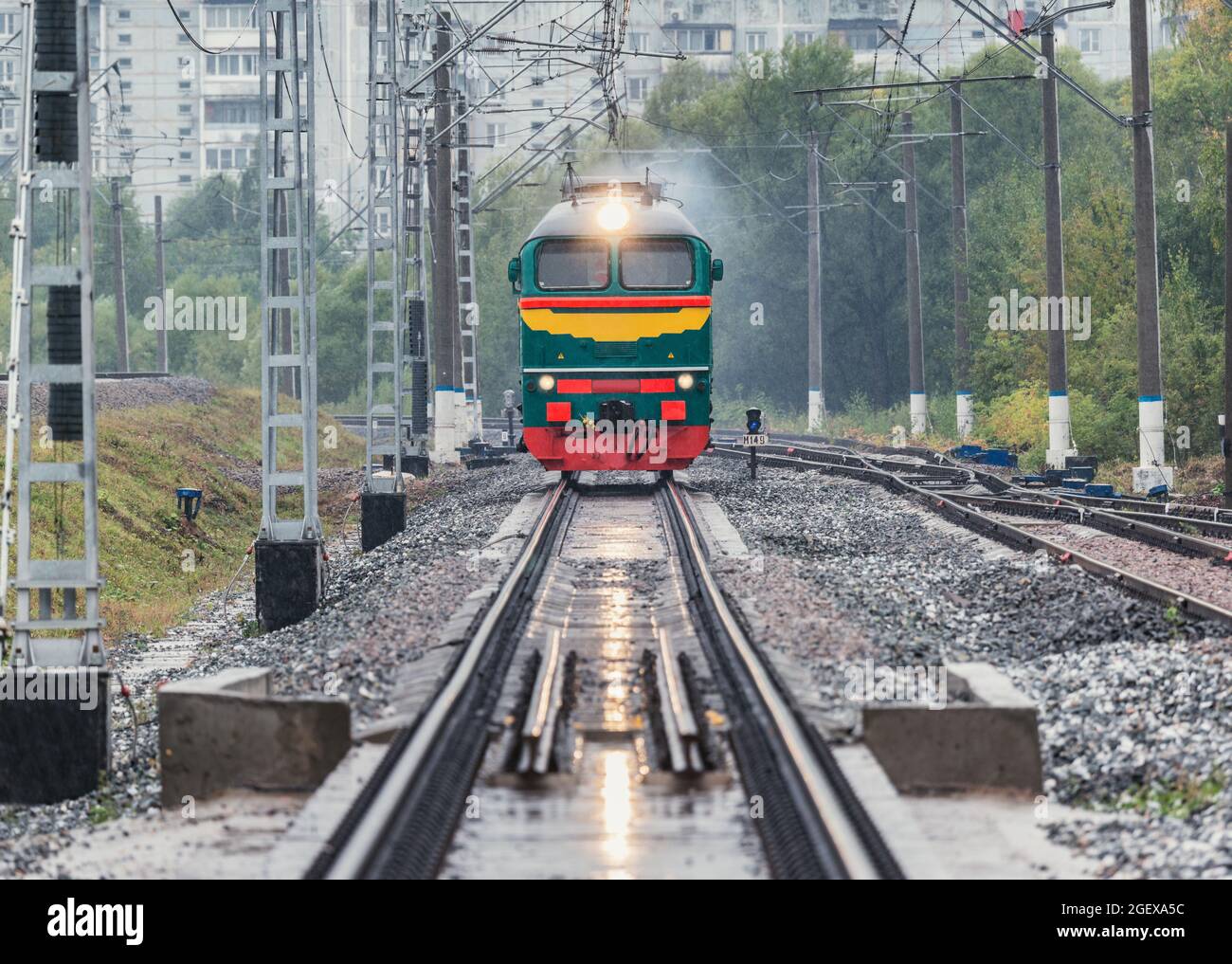 Freight retro diesel locomotive under the pouring rain Stock Photo - Alamy