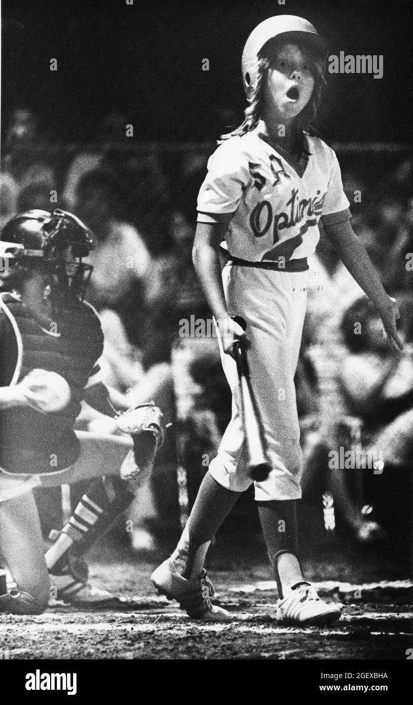 Bryan, Texas USA, circa 1978: Girl playing in Little League baseball ...