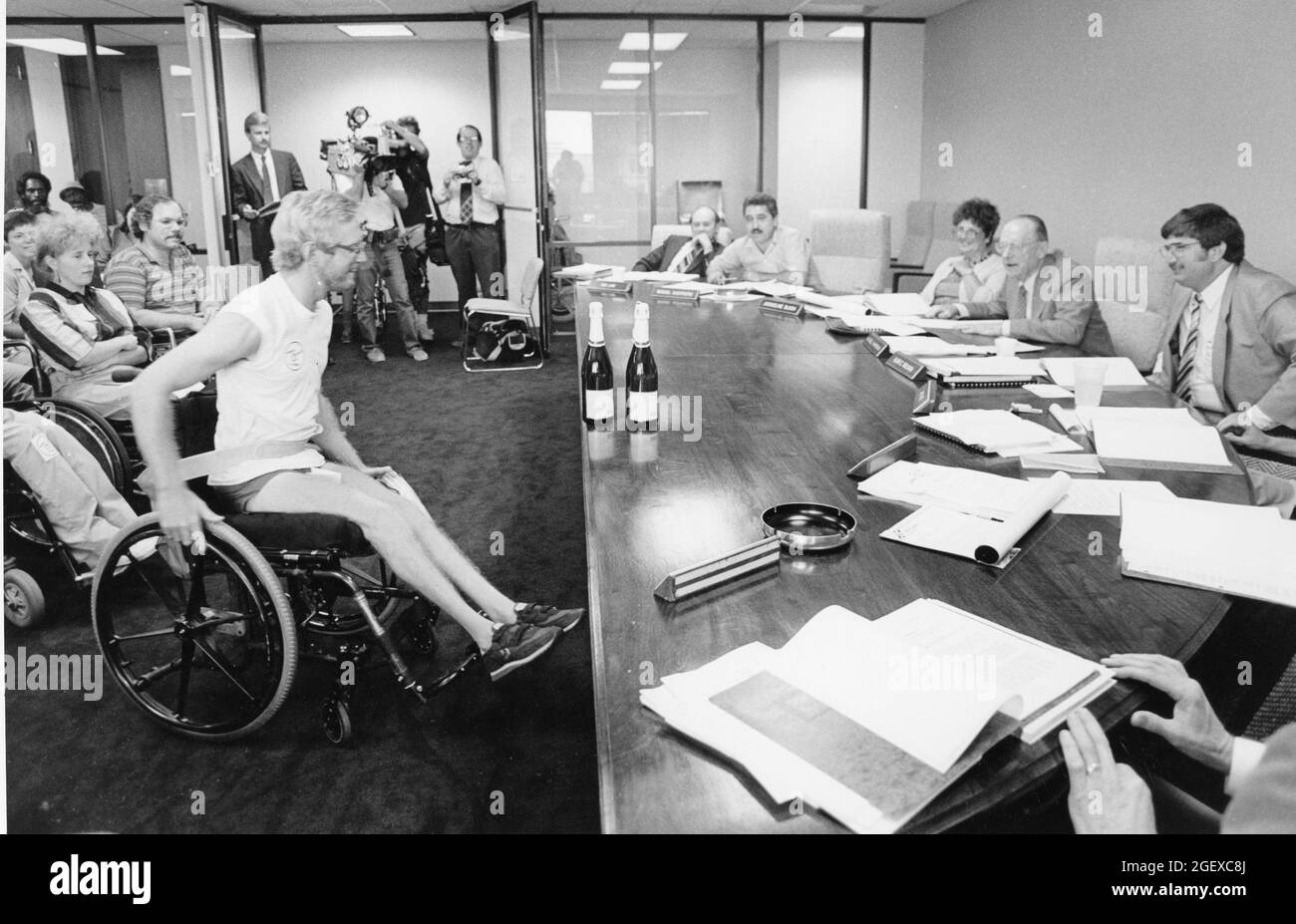 Austin Texas USA, circa 1990: Handicapped man in wheelchair speaks at a ...