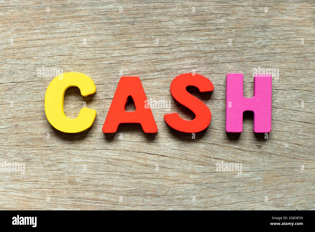 Color alphabet letter in word cash on wood background Stock Photo - Alamy