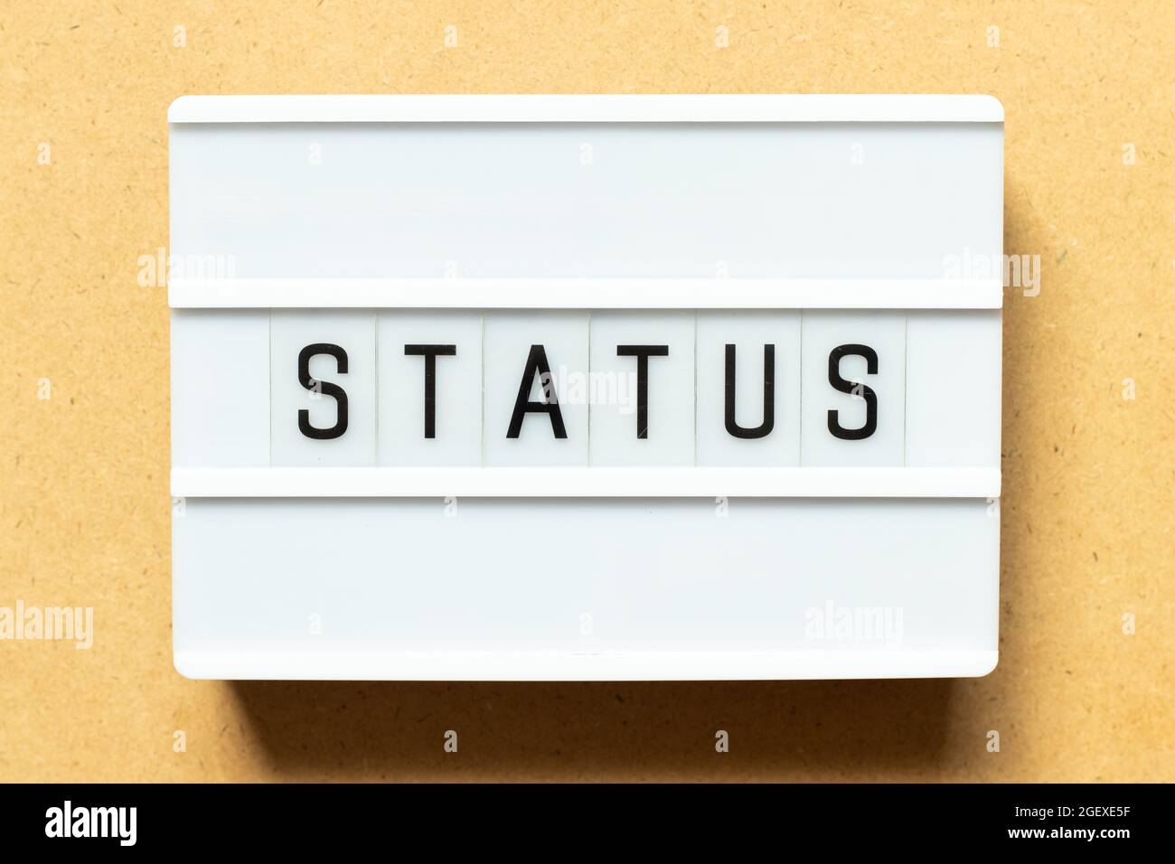 Lightbox with word status on wood background Stock Photo - Alamy
