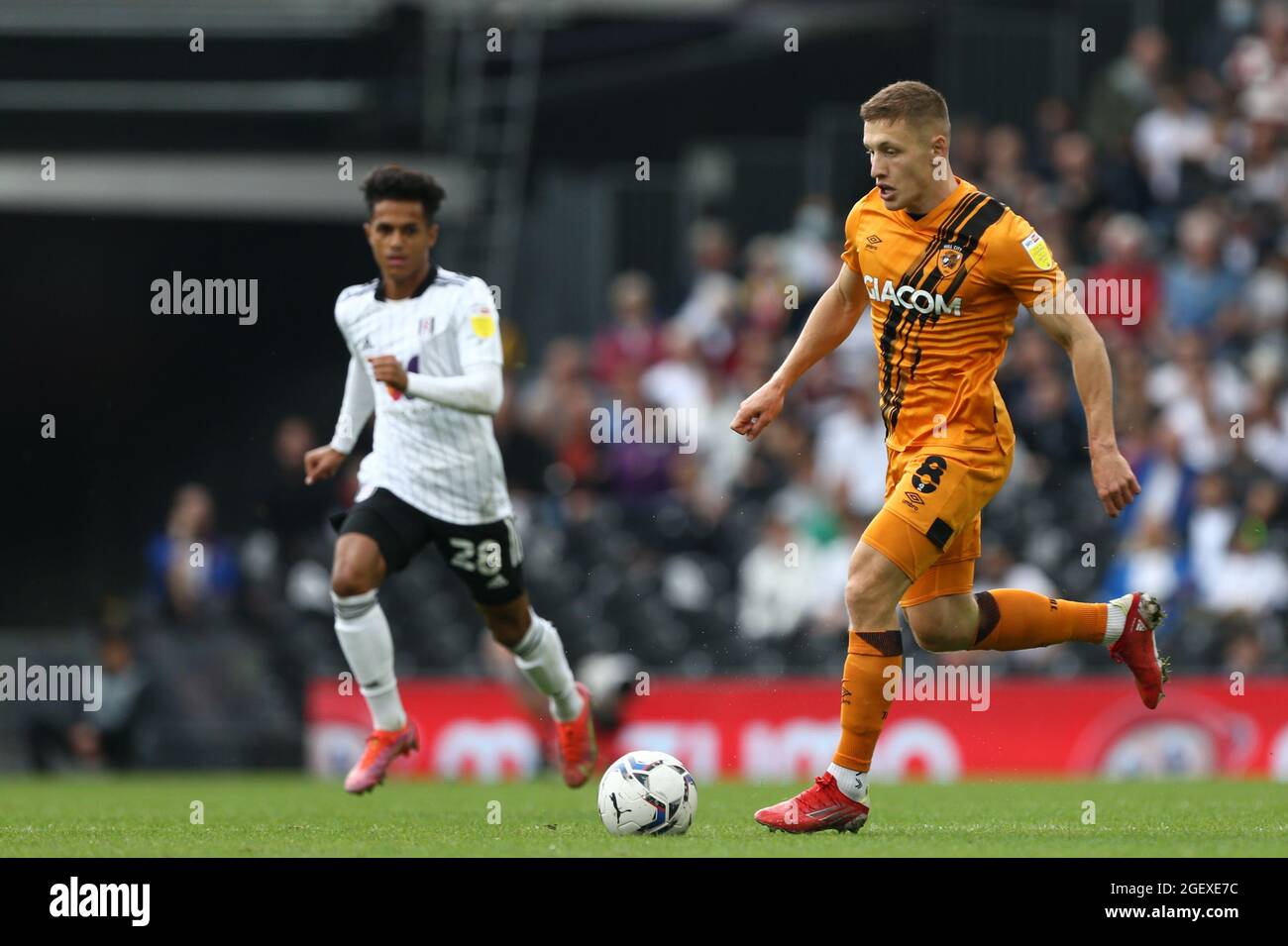 London, UK. 21st Aug, 2021. Greg Docherty #8 of Hull City running with ...