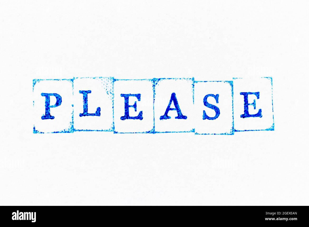 Blue color ink rubber stamp in word please on white paper background ...
