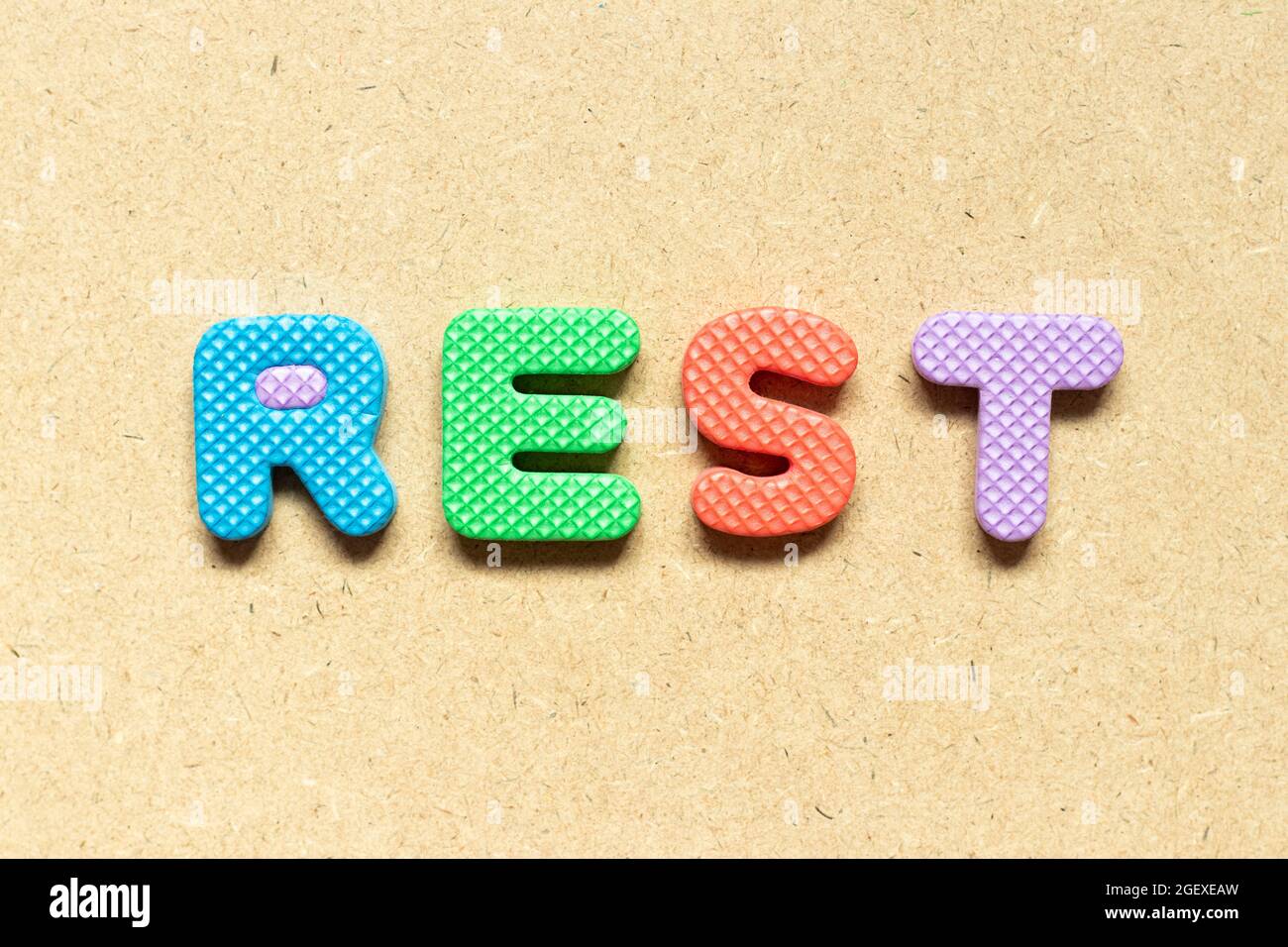 Foam alphabet letter in word rest on wood background Stock Photo - Alamy
