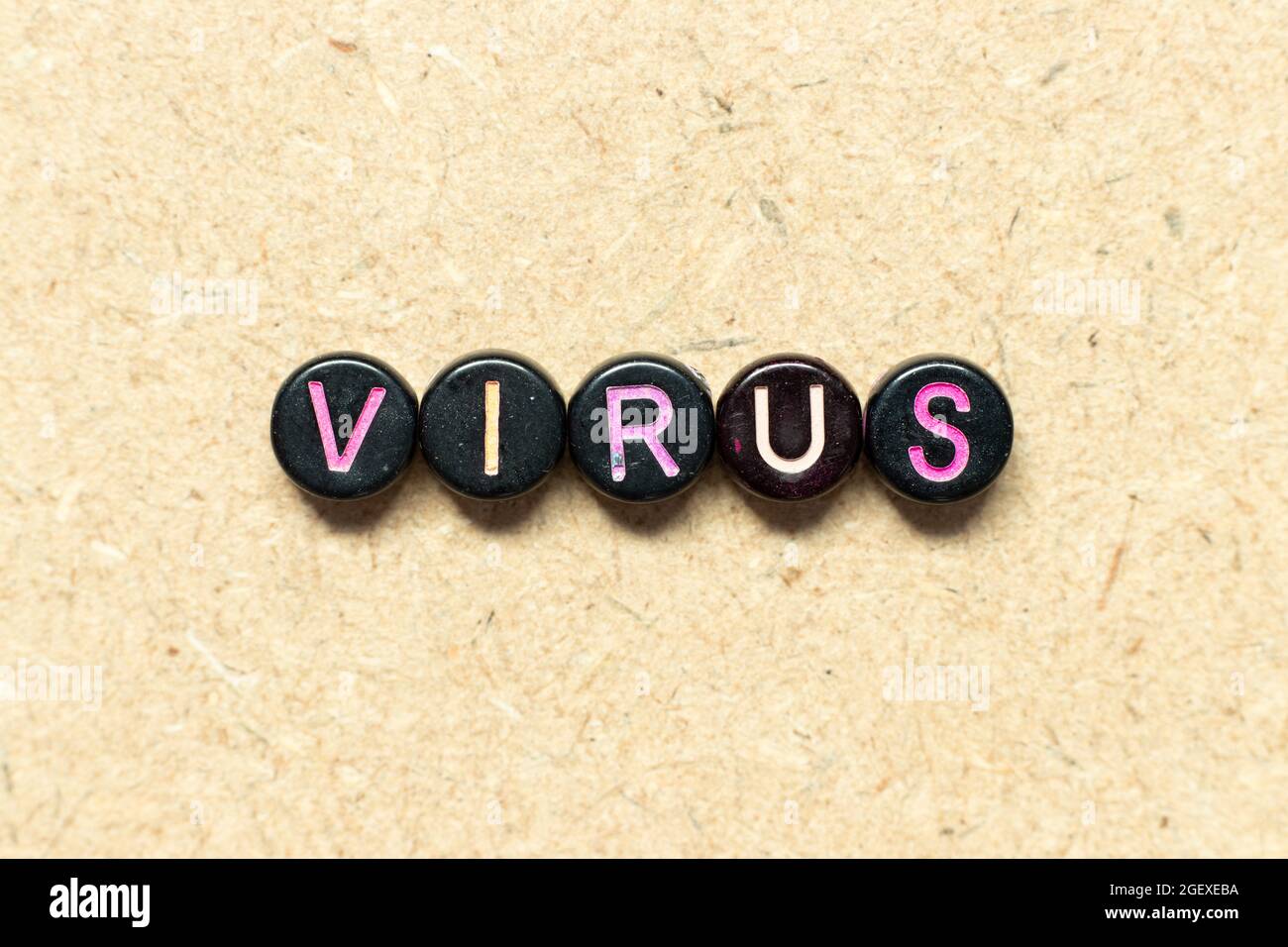 Black color round bead in word virus on wood background Stock Photo - Alamy