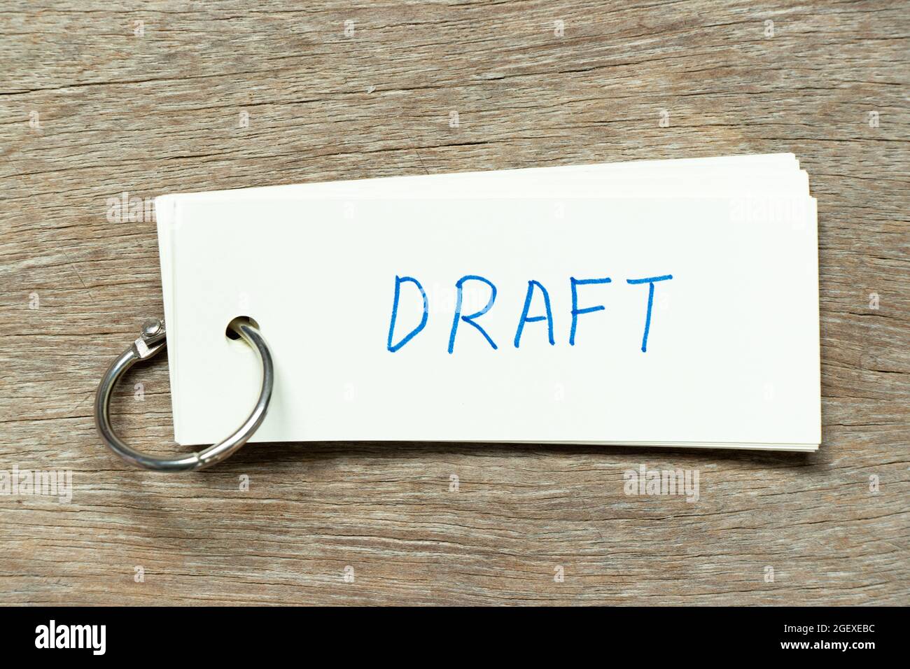 Flash card with handwriting word draft on wood background Stock Photo ...