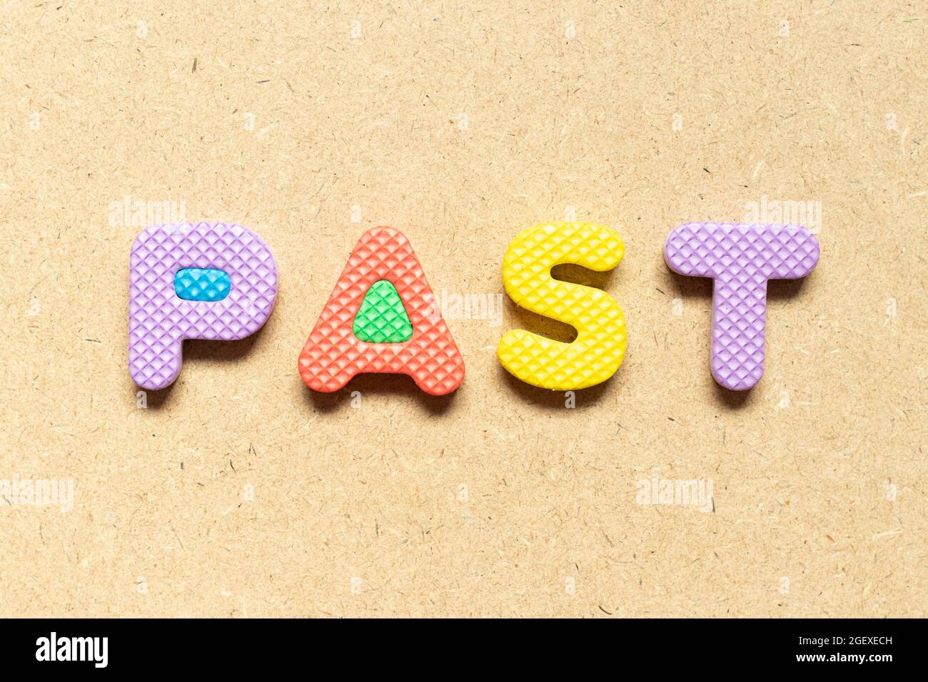 Foam alphabet letter in word past on wood background Stock Photo - Alamy