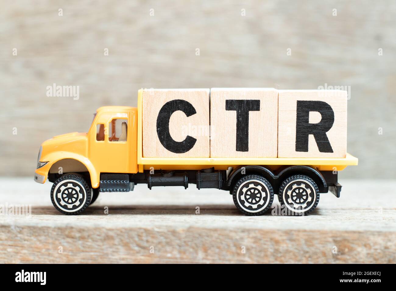 Toy truck hold alphabet letter block in word CTR (Abbreviation of Click ...
