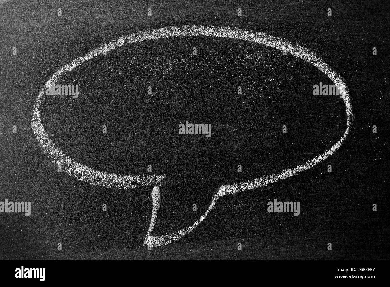 White color chalk hand drawing in round bubble speech shape with blank ...