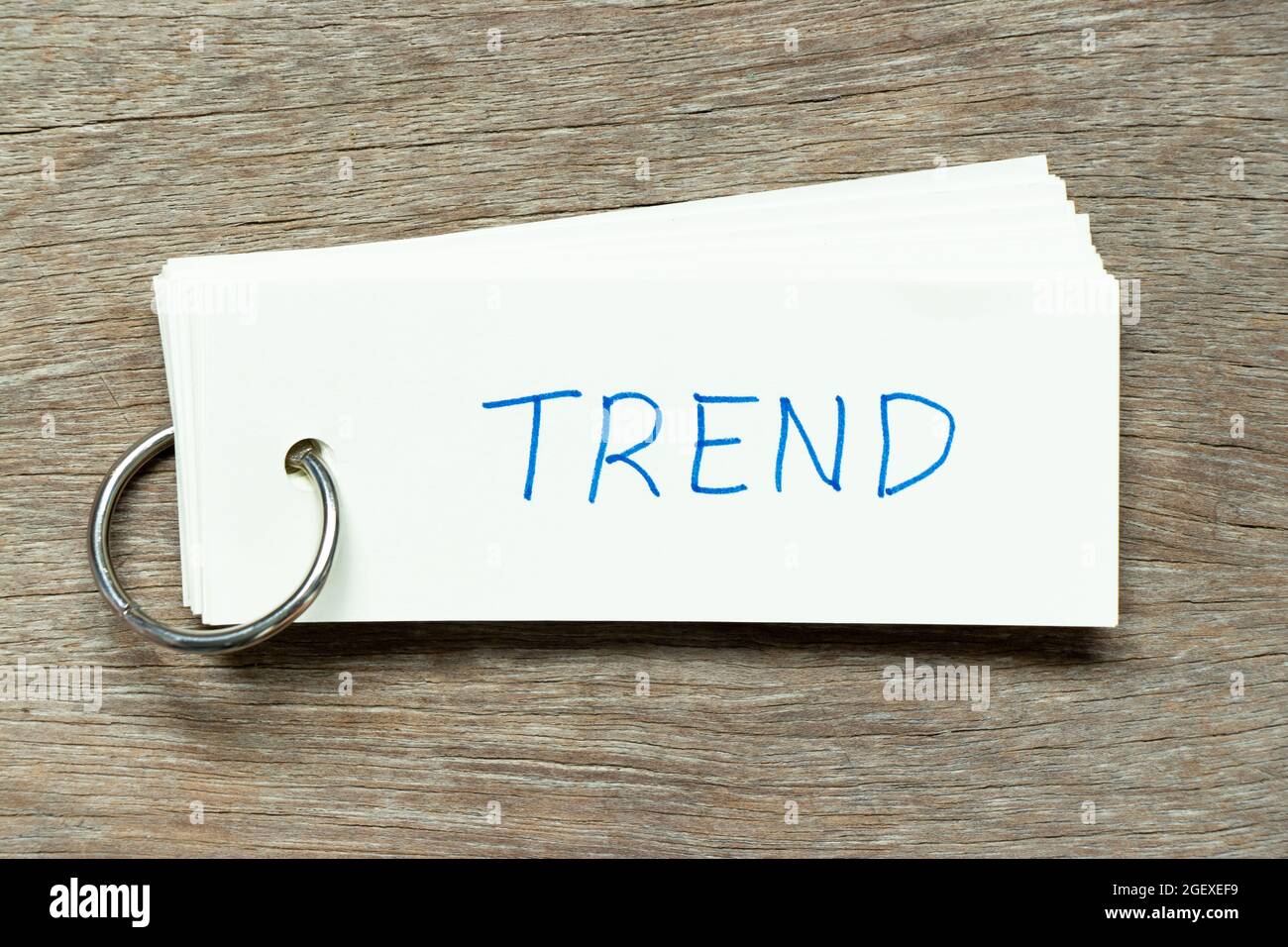 Flash card with handwriting word trend on wood background Stock Photo ...
