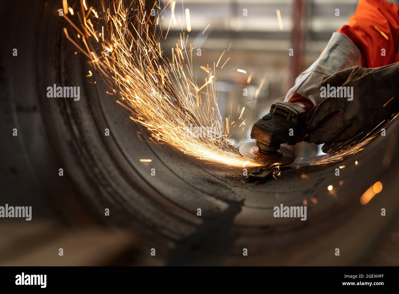Close-up of Electric wheel grinding at Industrial worker cutting metal ...