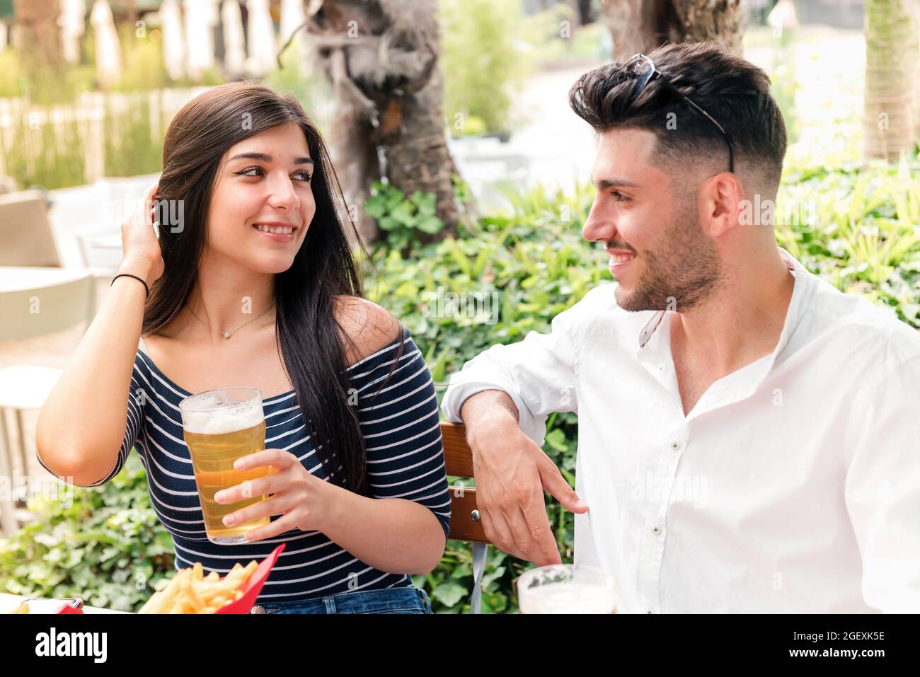 Romantic couple flirting outdoors hi-res stock photography and images ...