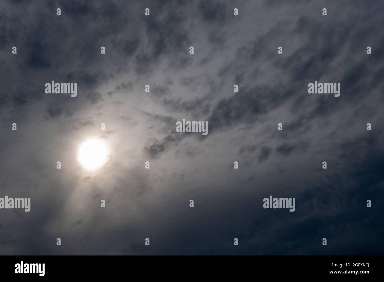 Gorgeous cloud pattern in the sky with the sun trying to shine through ...