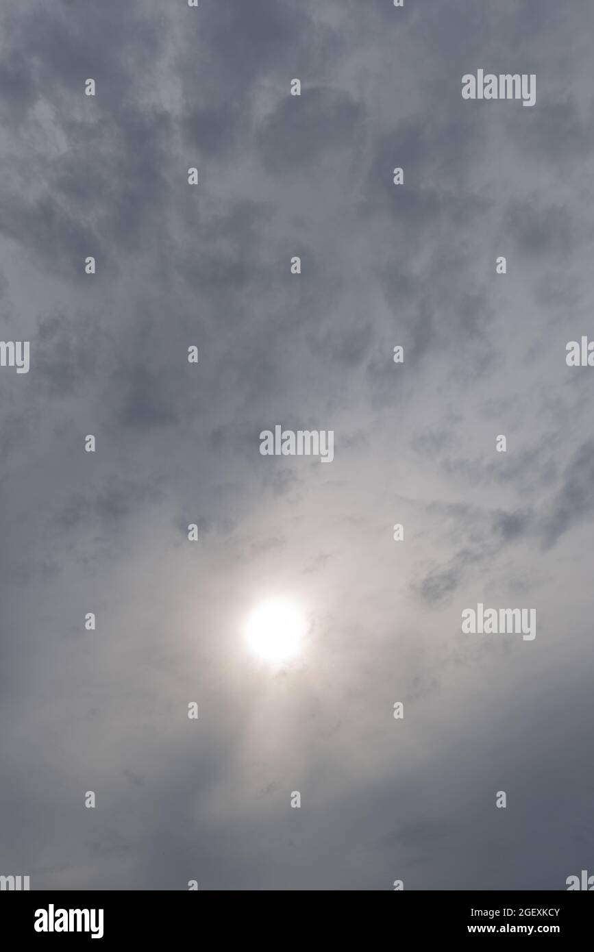 Gorgeous cloud pattern in the sky with the sun trying to shine through ...