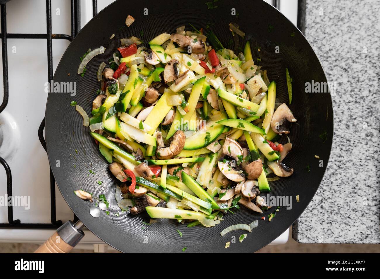 Chopped vegetables being cooked hi-res stock photography and images - Alamy