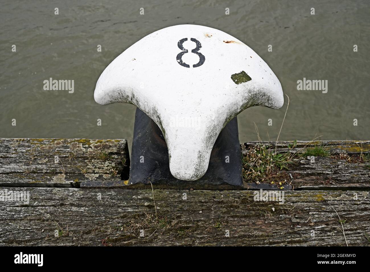 rotterdam / netherlands - 2021.08.04: a steel bollard at an old wooden ...