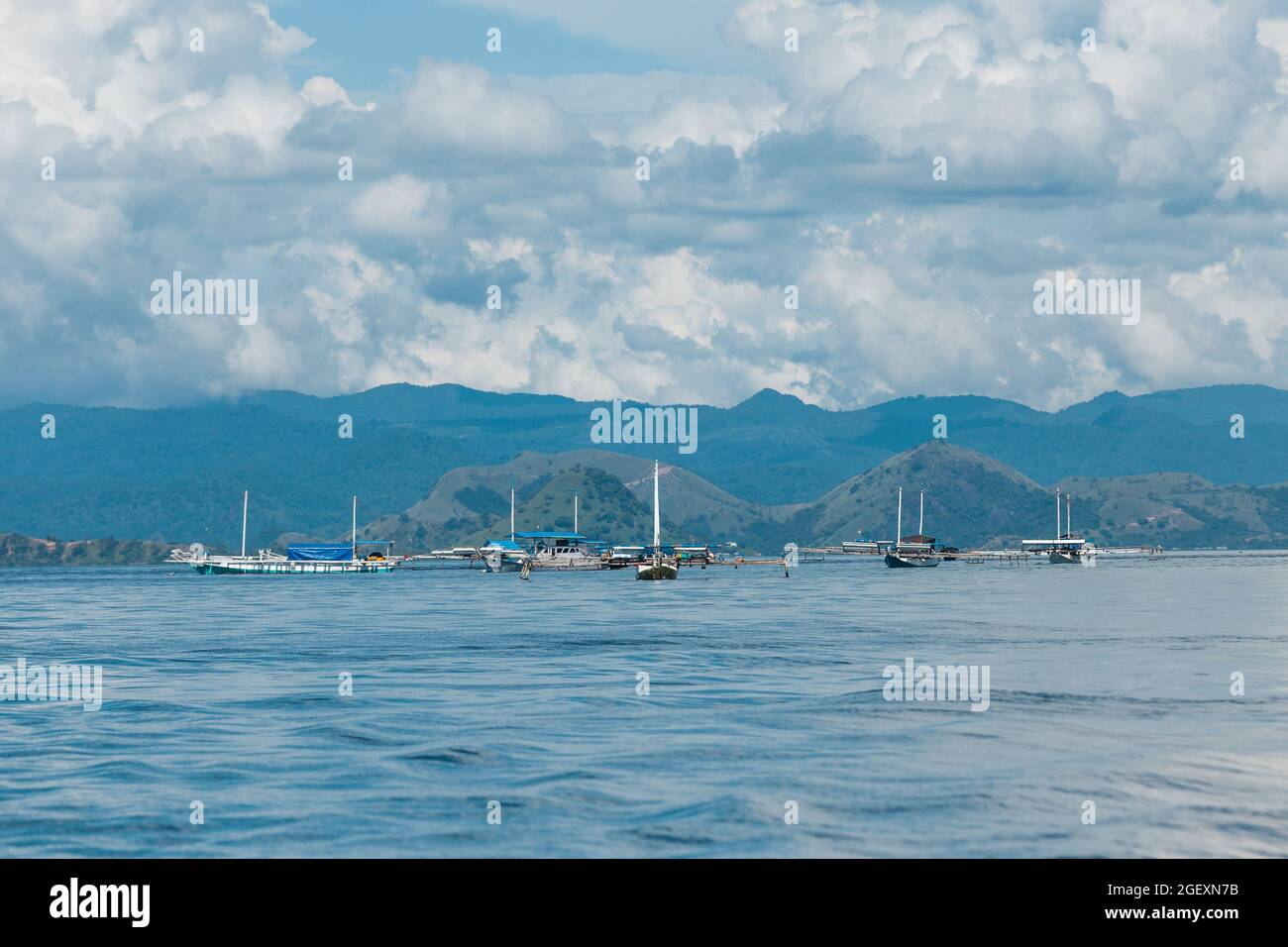 Boats floating in sea water Stock Photo - Alamy