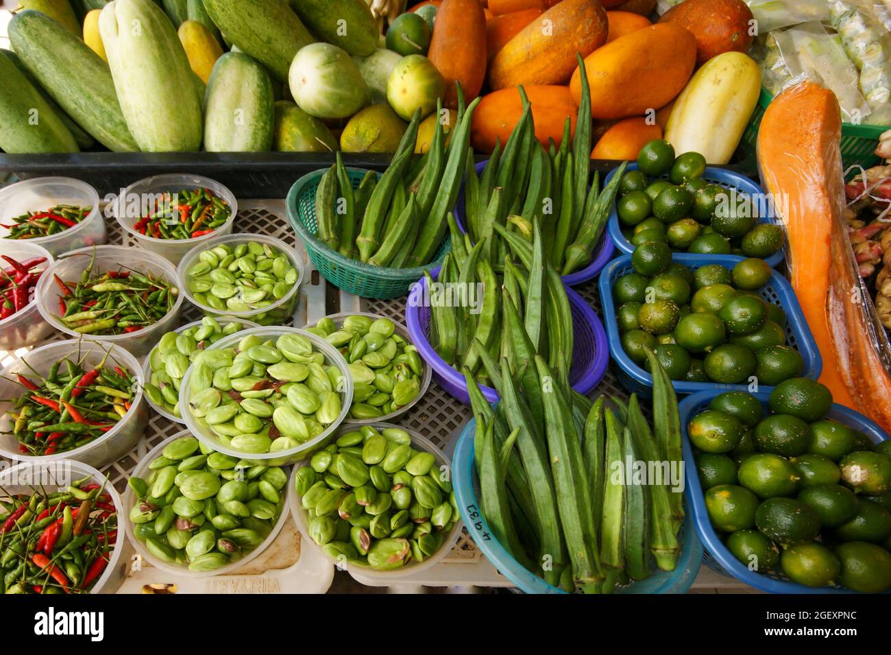 Fruit and vegetables with okra, beans and lime for sale on a local ...