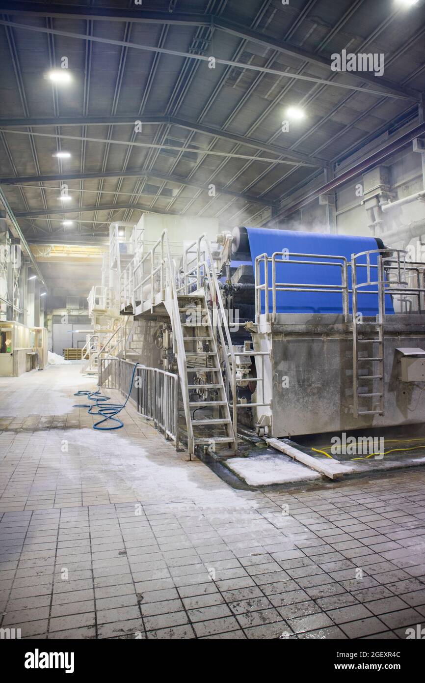 Industrial machinery for converting cellulose into a sheet of paper ...