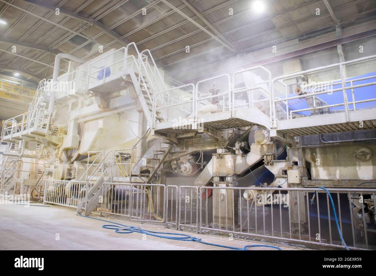 Industrial machinery for converting cellulose into a sheet of paper ...