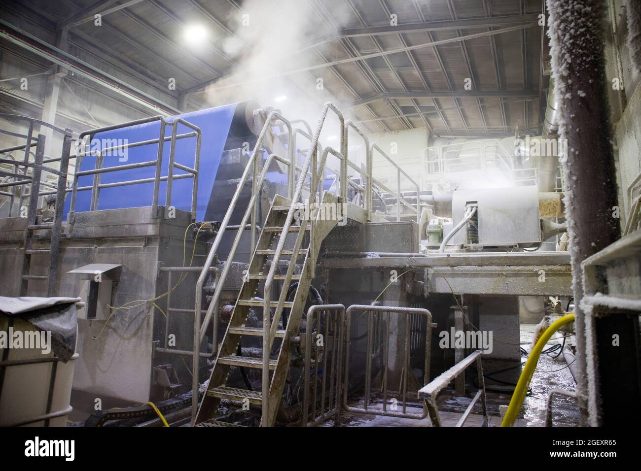 Industrial machinery for converting cellulose into a sheet of paper ...