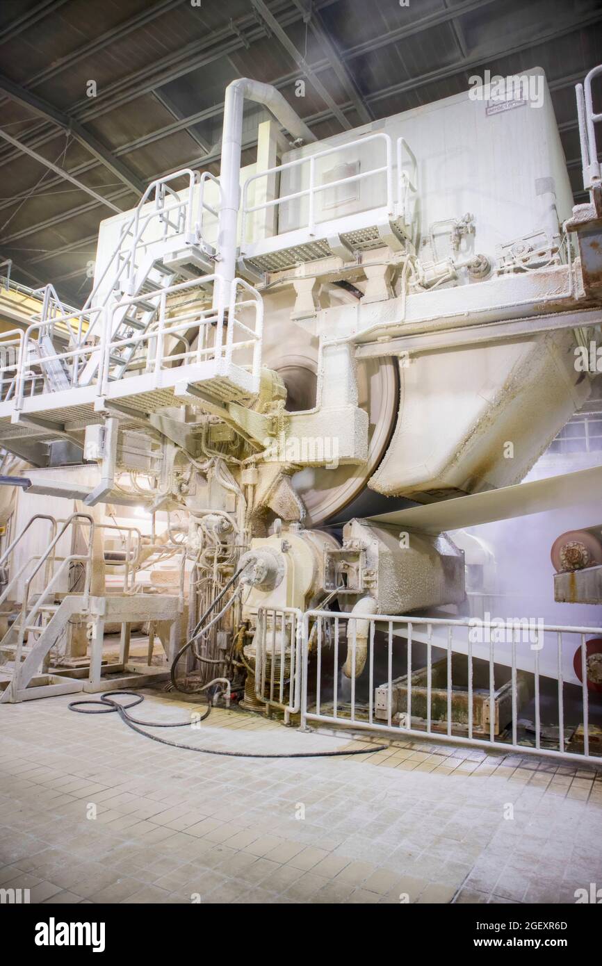 Industrial machinery for converting cellulose into a sheet of paper ...