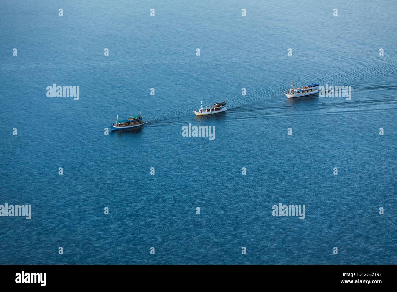 Three boats floating in the sea Stock Photo - Alamy