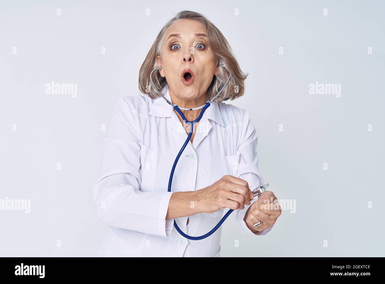 female doctor datascope treatment therapist Stock Photo - Alamy