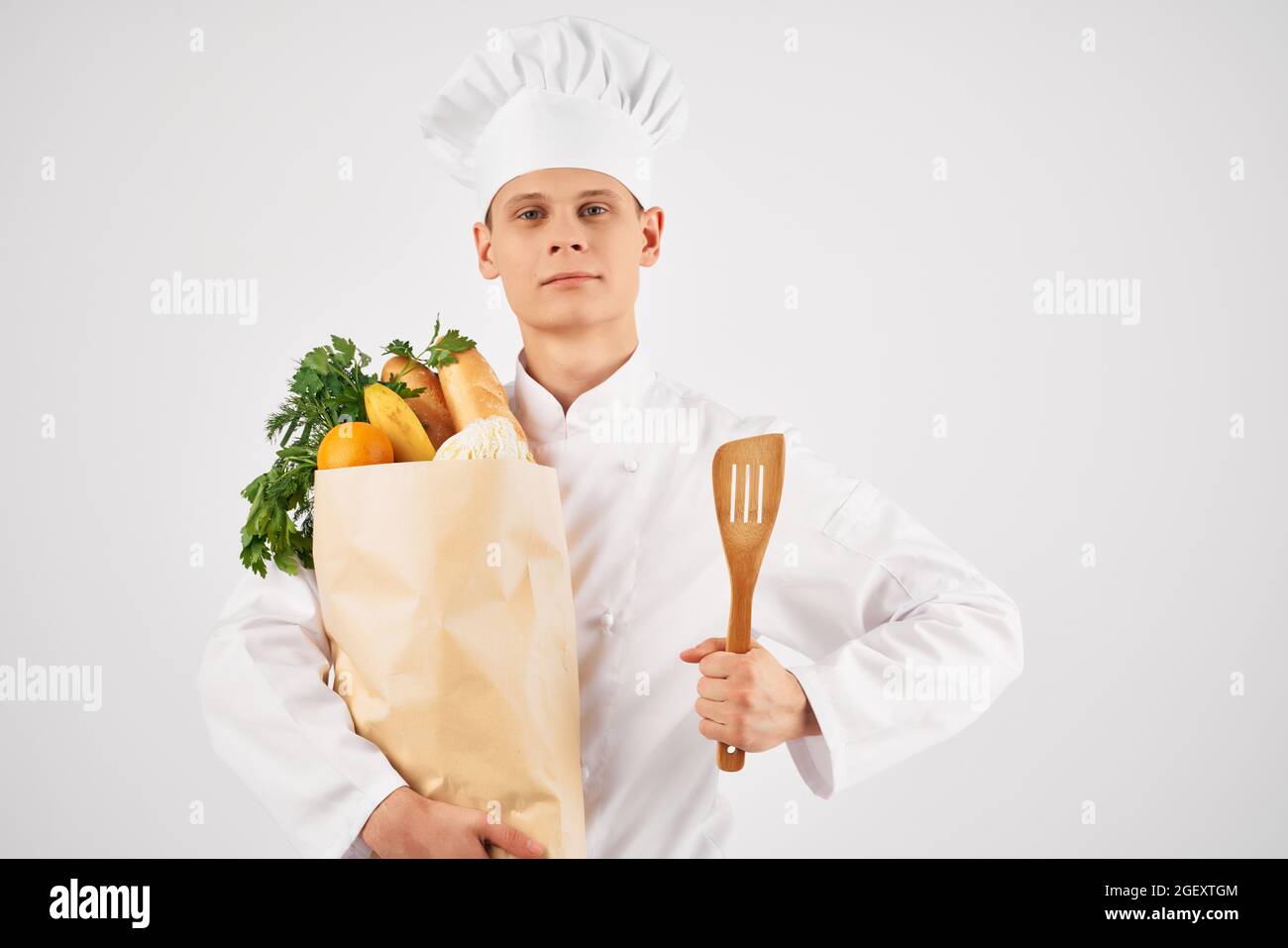 man in chef uniform food delivery supermarket service Stock Photo - Alamy