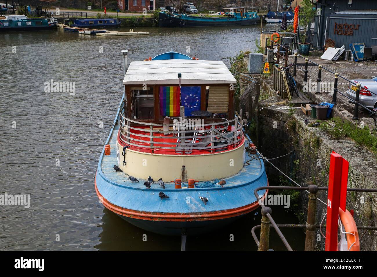 A flag of Europe and a Rainbow flag are seen on a barge at River Avon ...