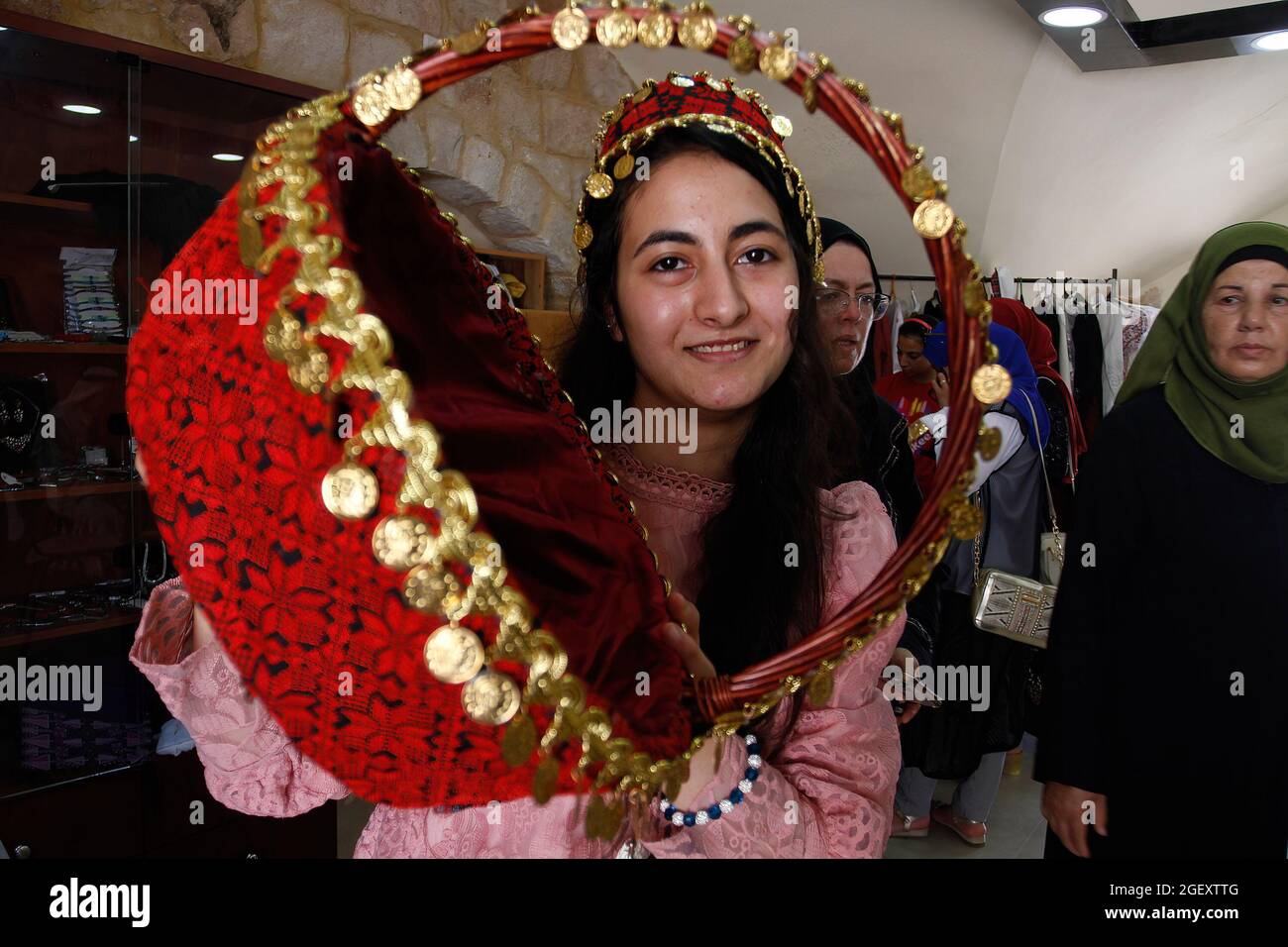 Nablus, Palestine. 21st Aug, 2021. A Palestinian attends an exhibition ...