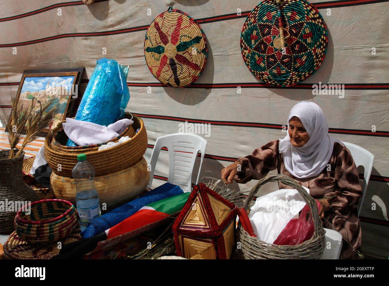 A Palestinian woman attends an exhibition of Palestinian heritage on ...
