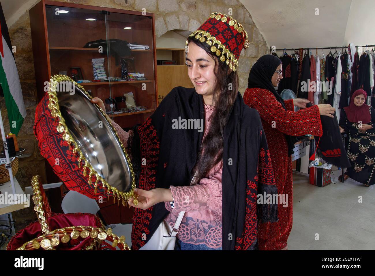 A Palestinian attends an exhibition of Palestinian heritage on the ...