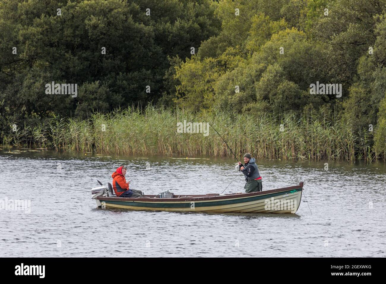 Inchigeelagh, Cork, ireland. 21st August, 2021. Men fishing on a ...