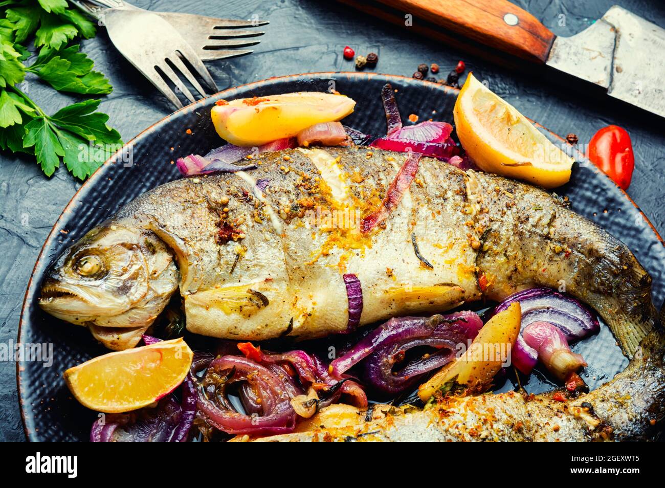 Delicious river trout fried in onion and lemon. Baked rainbow trout ...