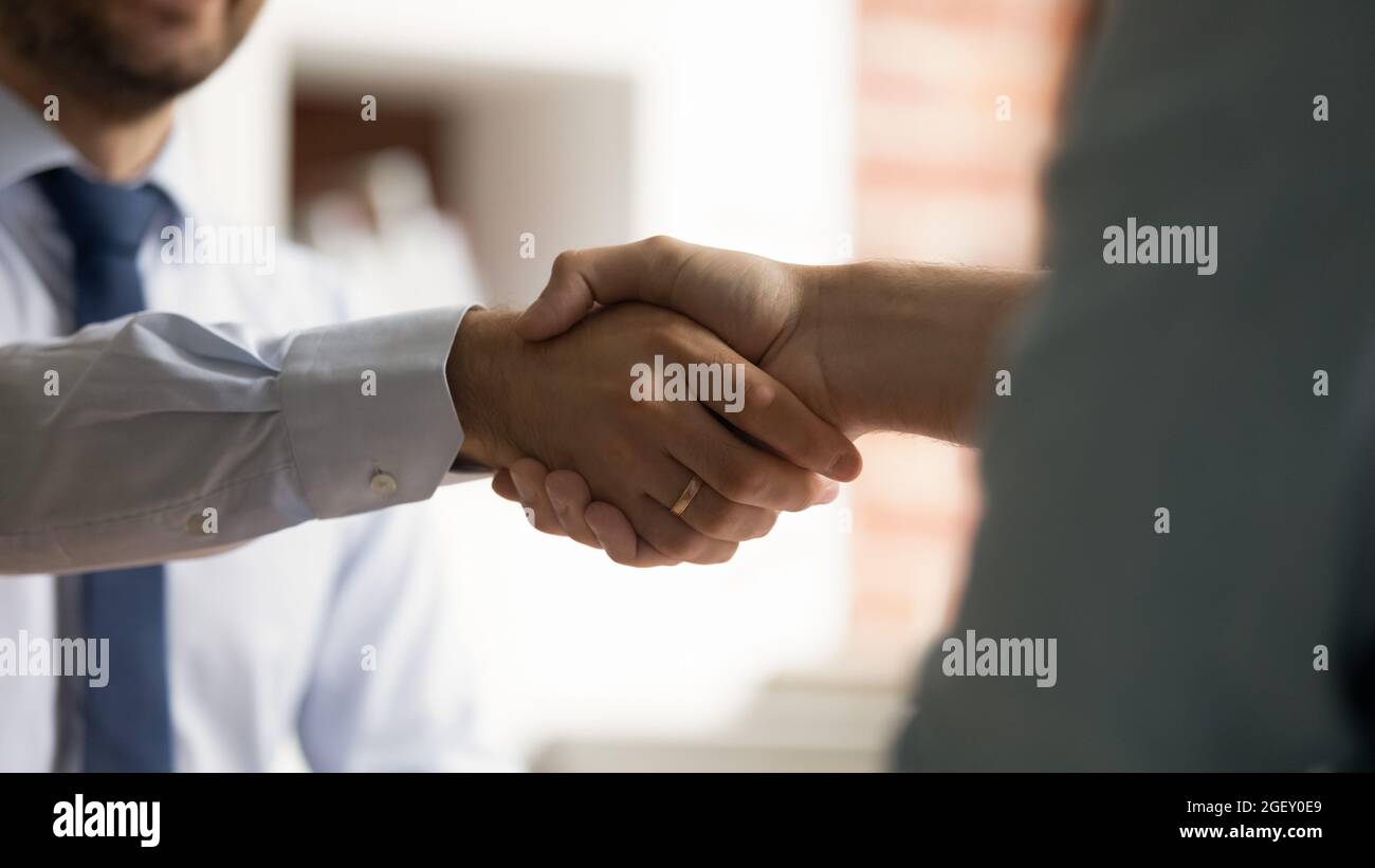 Close up view two business men shaking hands Stock Photo - Alamy