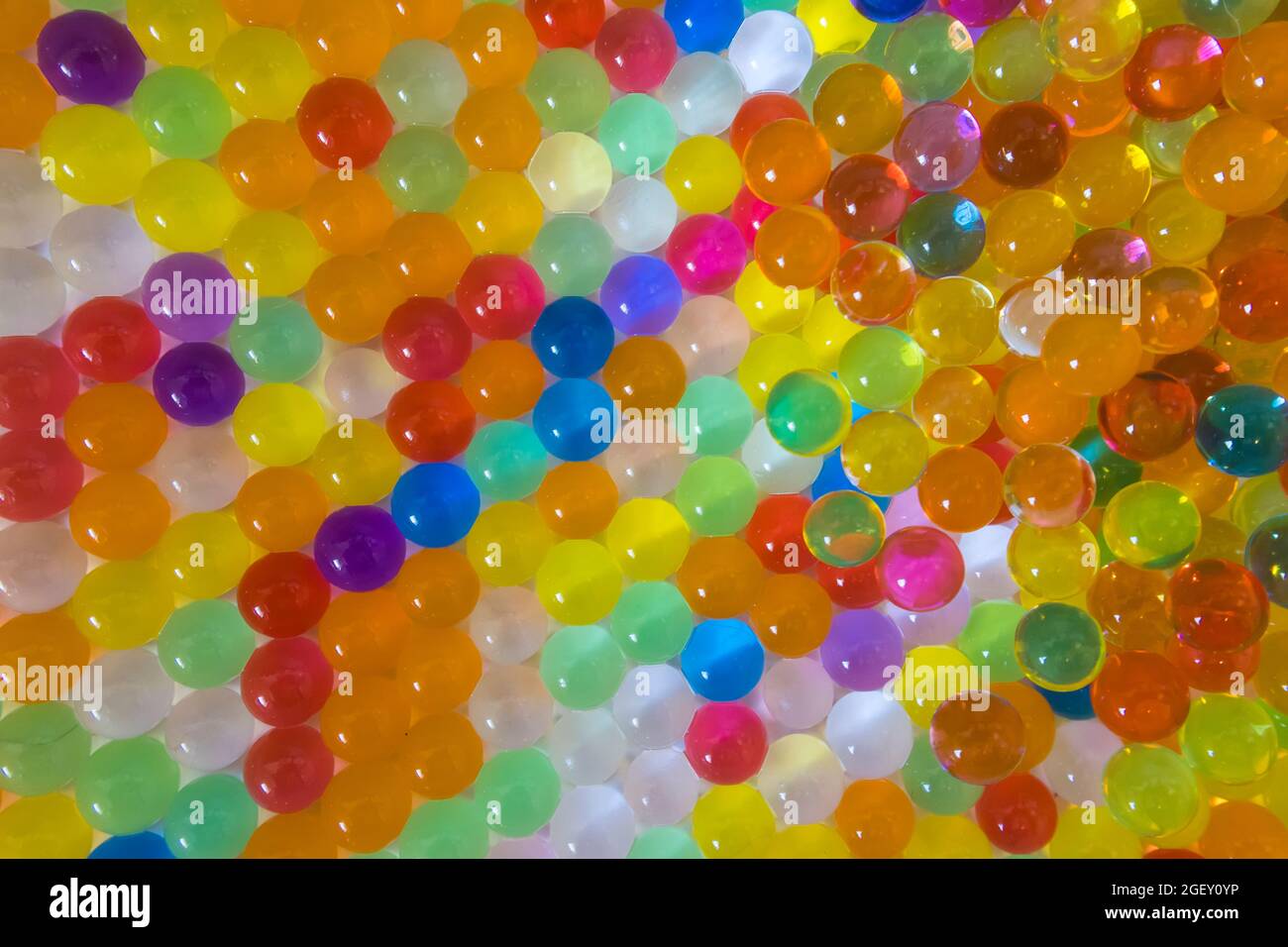 Lots of different colored hydrogel balls. Set of multicolored orbis ...