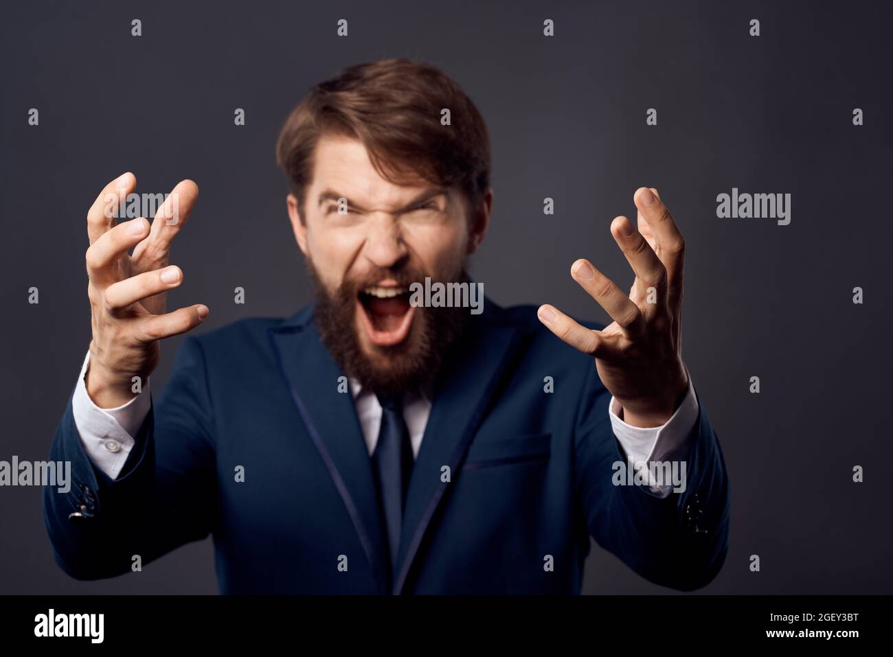 The man in a suit success Job dark background Stock Photo - Alamy