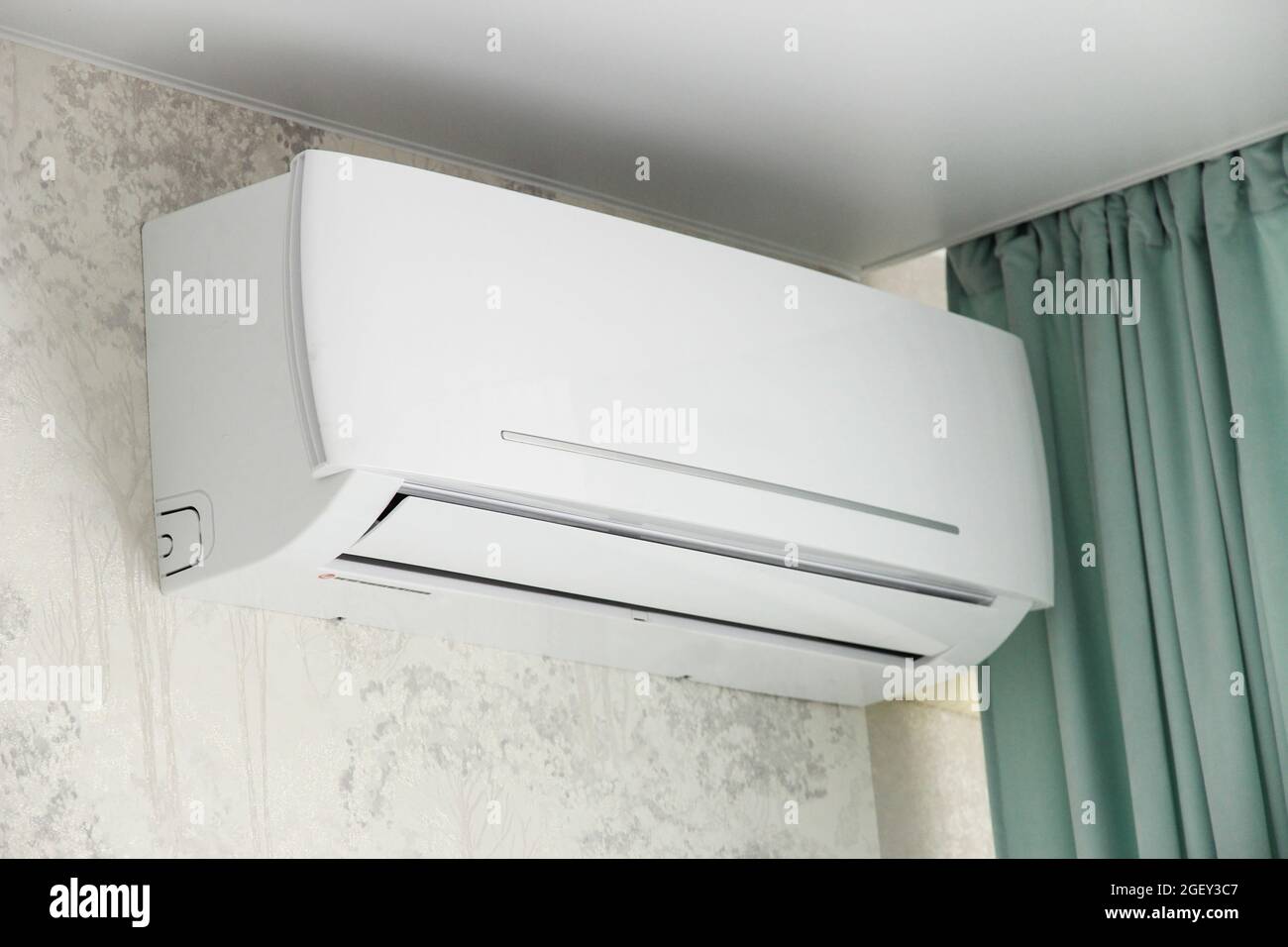 Indoor unit of the air conditioner in the room on the wall Stock Photo ...