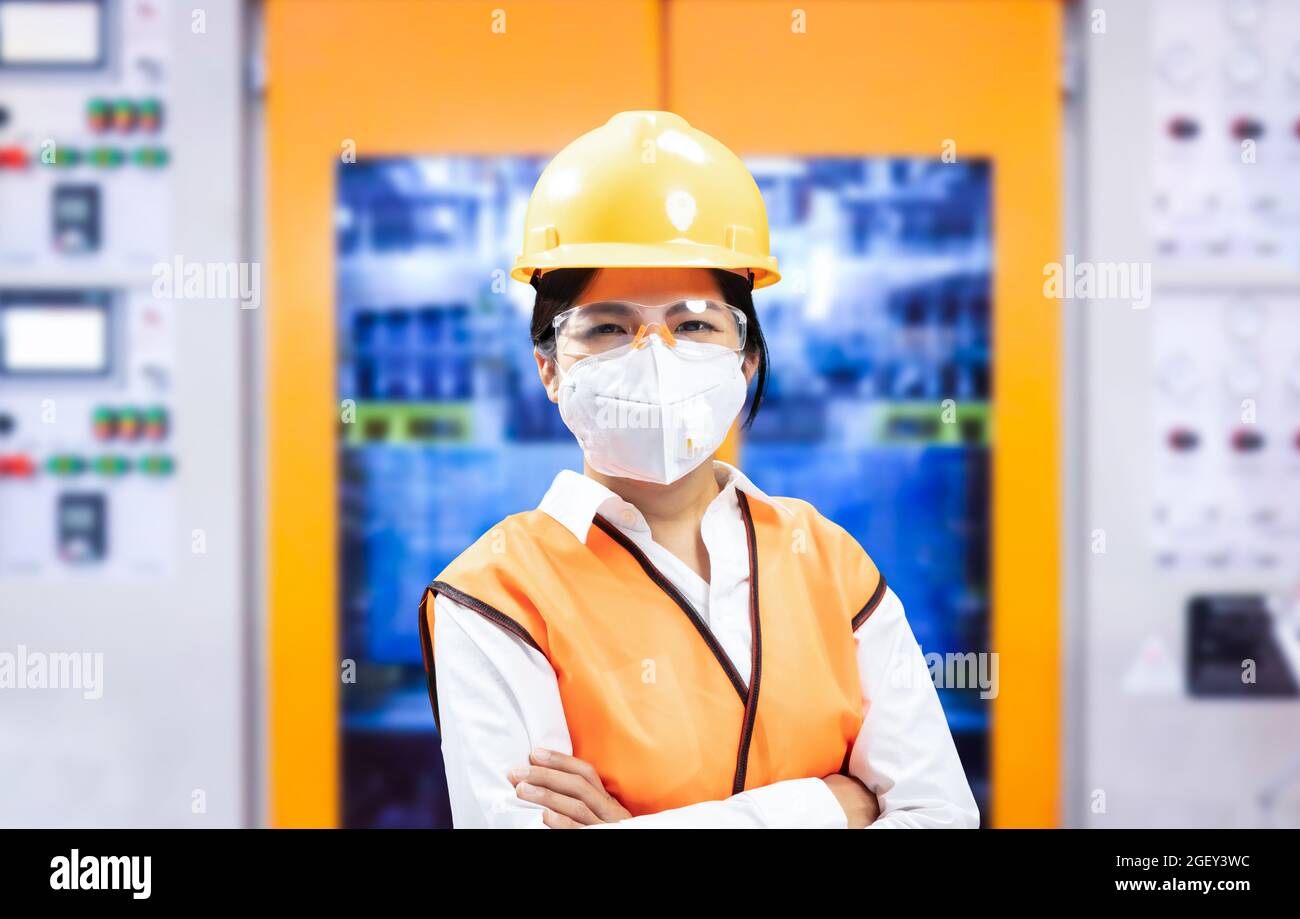 Asian engineer or technician wear safety helmet and reflective vest ...
