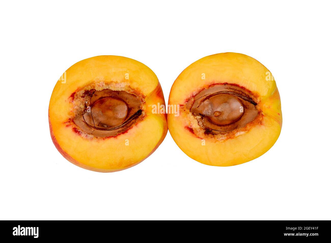 Beautiful peach halves isolated on white background Stock Photo - Alamy