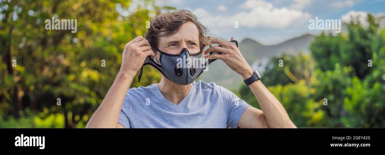 BANNER, LONG FORMAT Runner wearing medical mask, Coronavirus pandemic ...