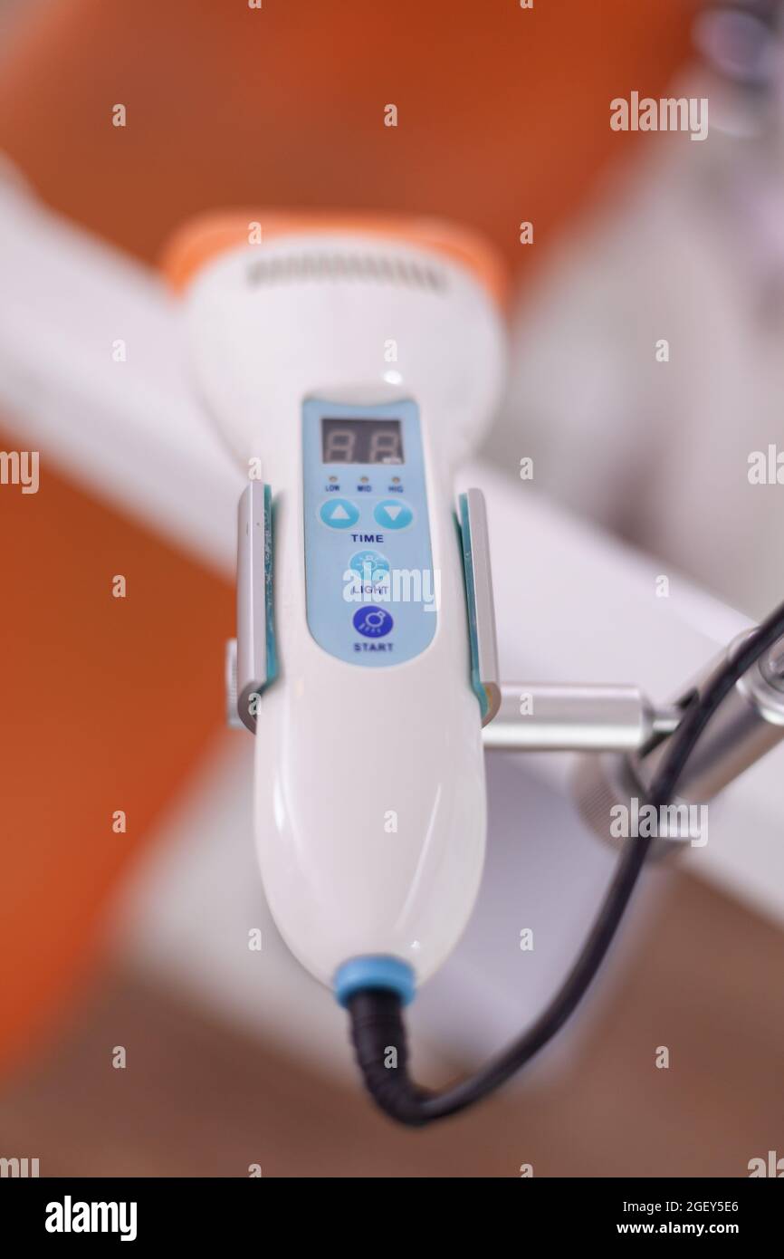 Ultraviolet lamp teeth ready for whitening procedure in dental ...