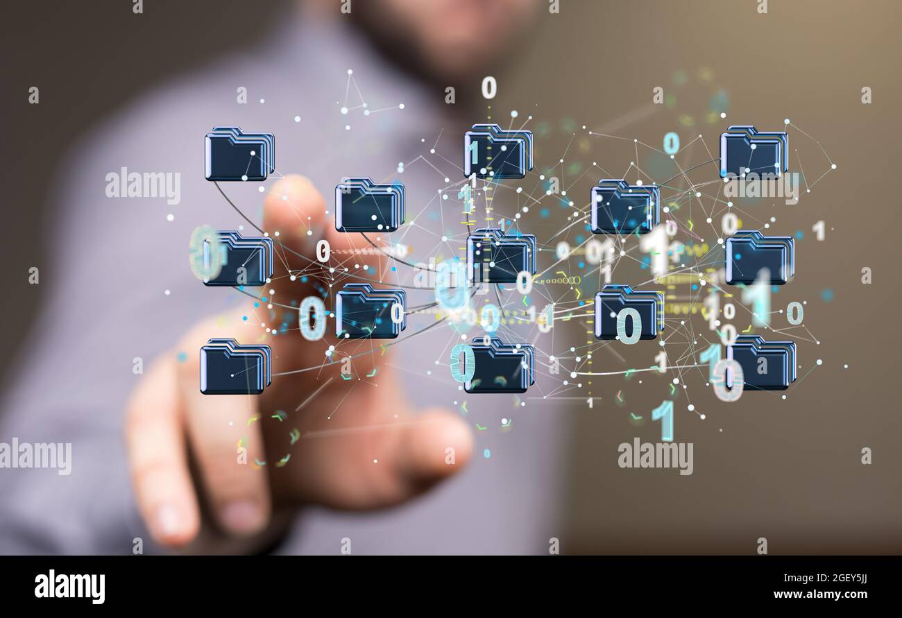 A businessman holding virtual folders symbolizing the data connection ...
