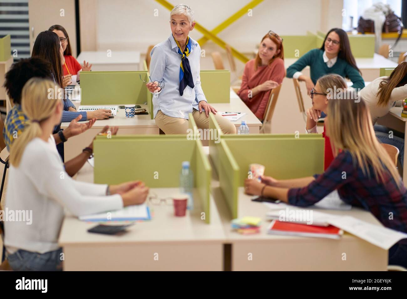 Students enjoying in the lecture by cool female professor in the ...