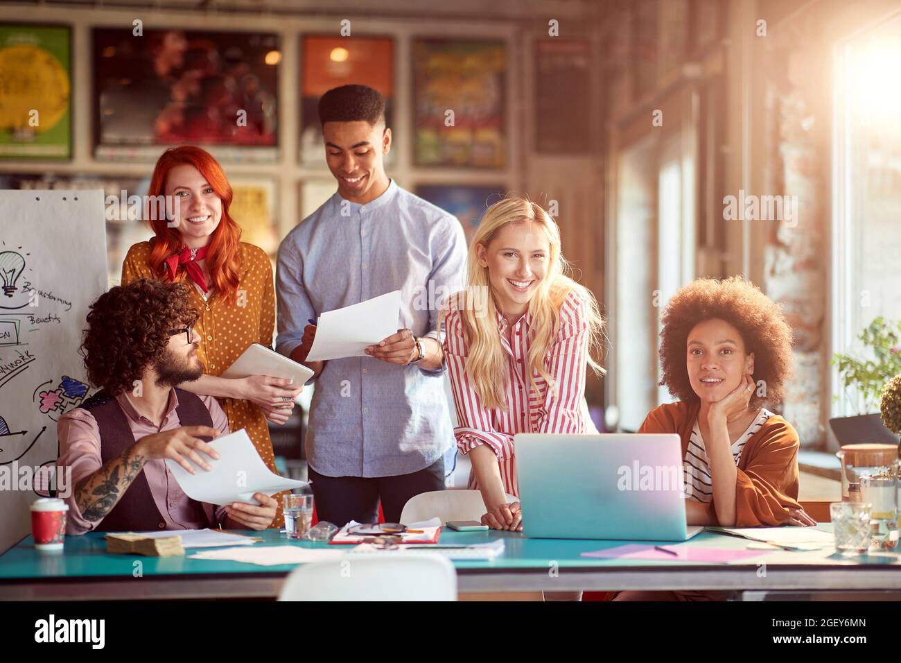 spontaneous image of group of people working together in open space ...