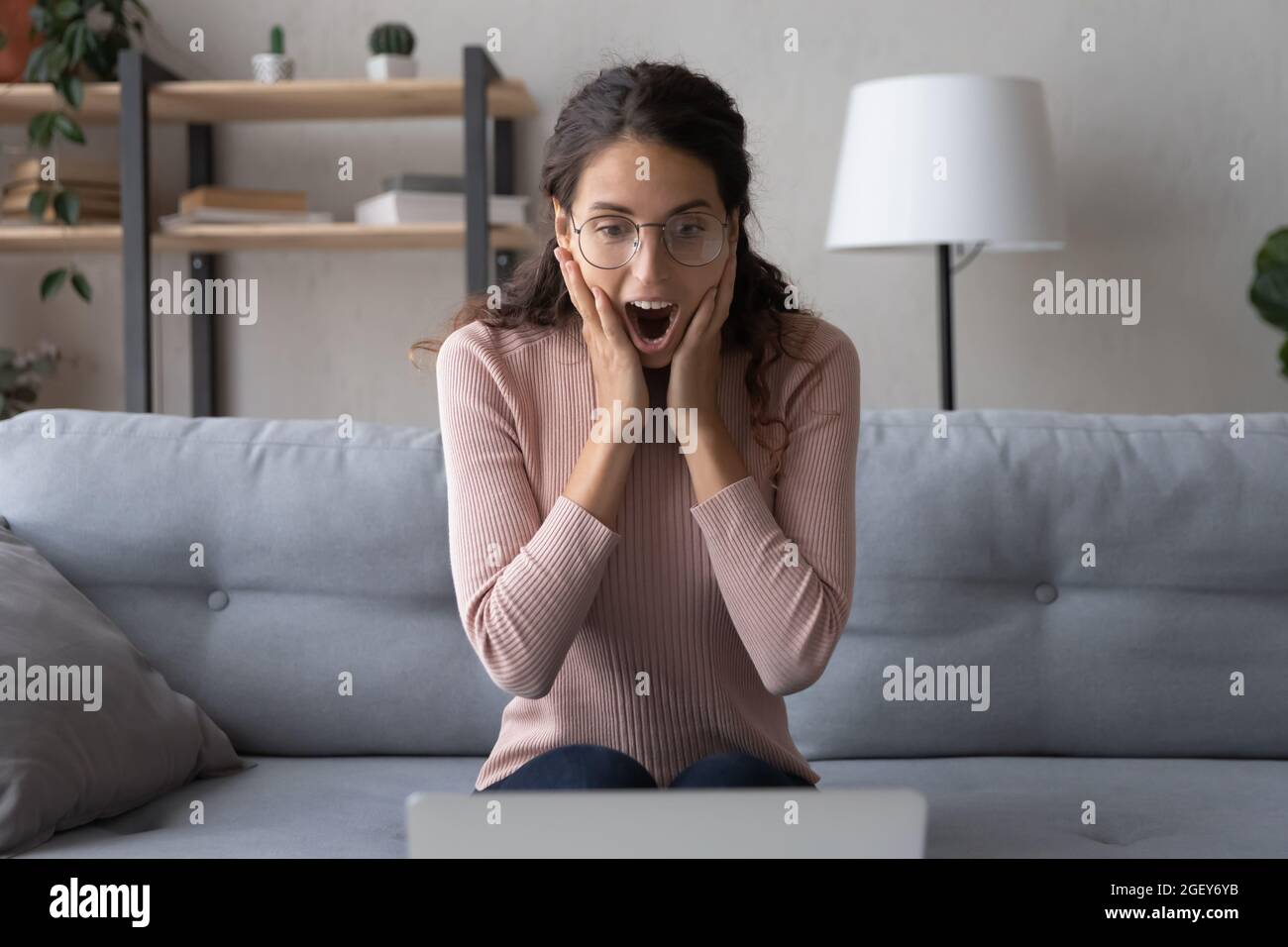 Young woman open mouth while read unbelievable incredible media news ...