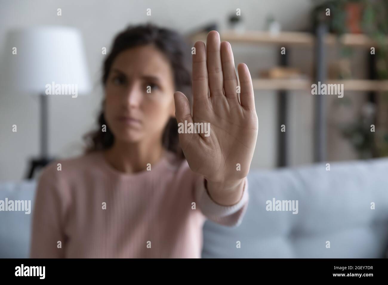 Closeup of young woman show stop gesture sign by hand Stock Photo - Alamy
